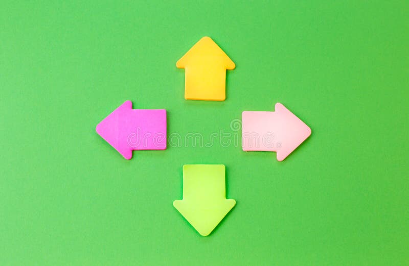 Green Background With Colorful Arrow Signs. The Concept Of Choosing A ...