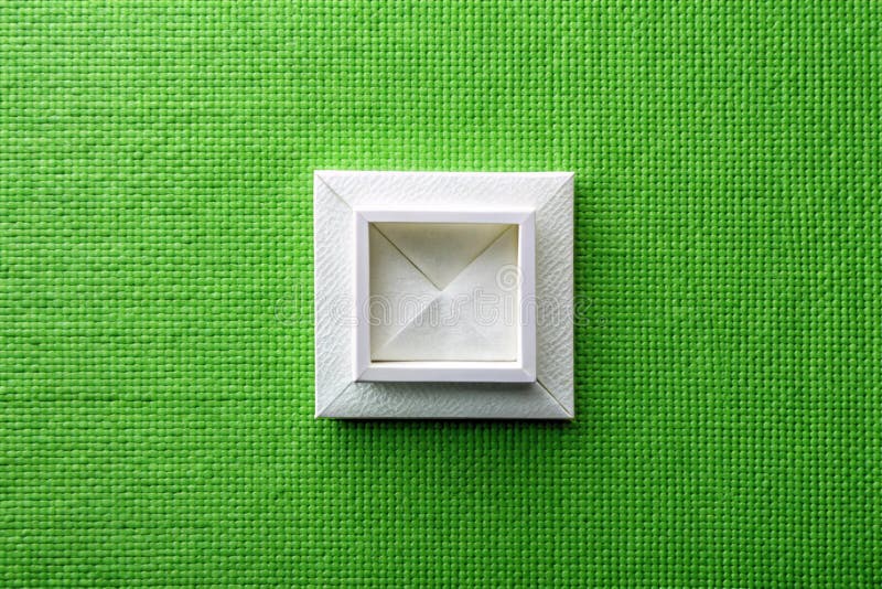 A Green Background with a White Object in the Middle. the Object is a ...