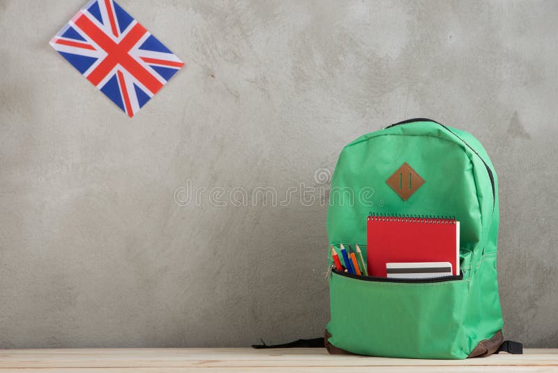 Green Backpack, Flag of the Great Britain and Notebooks Against a ...