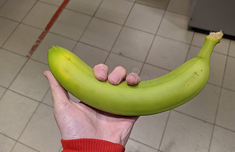 Green Banana in Guy& X27;s Hand First Person View. Stock Image - Image ...