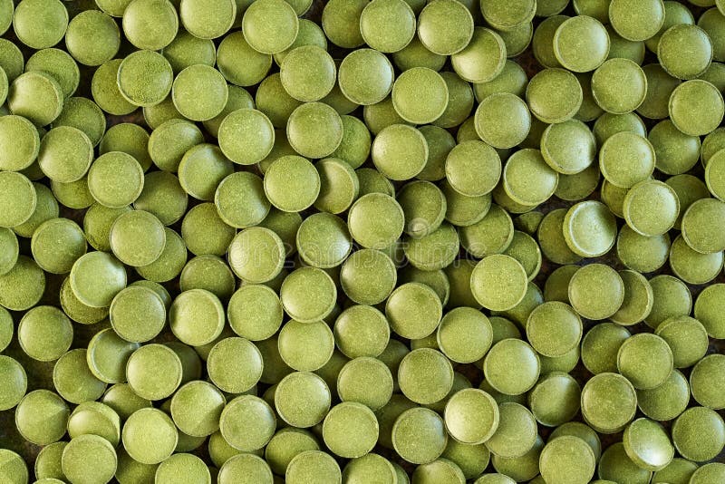 Top View of Green Barley Grass Tablets - Textured Background Stock ...
