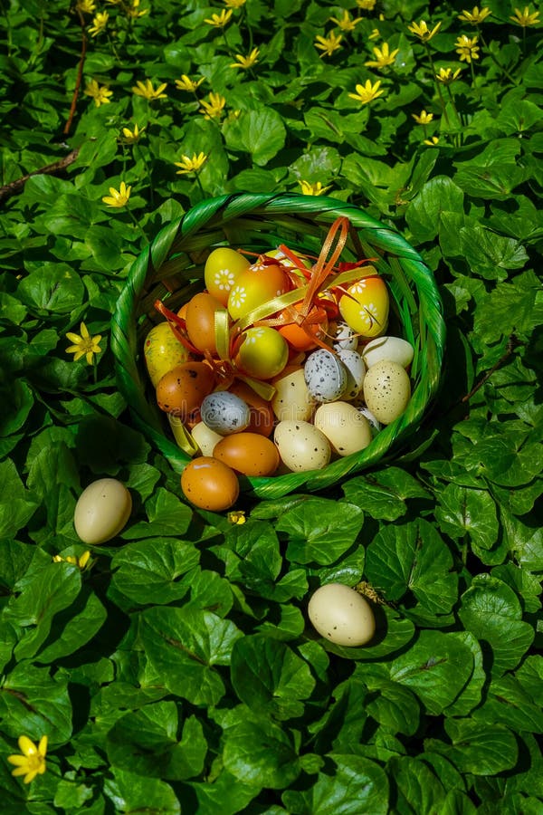 Green Basket with Colorful Decorative Easter Eggs on Light Background ...