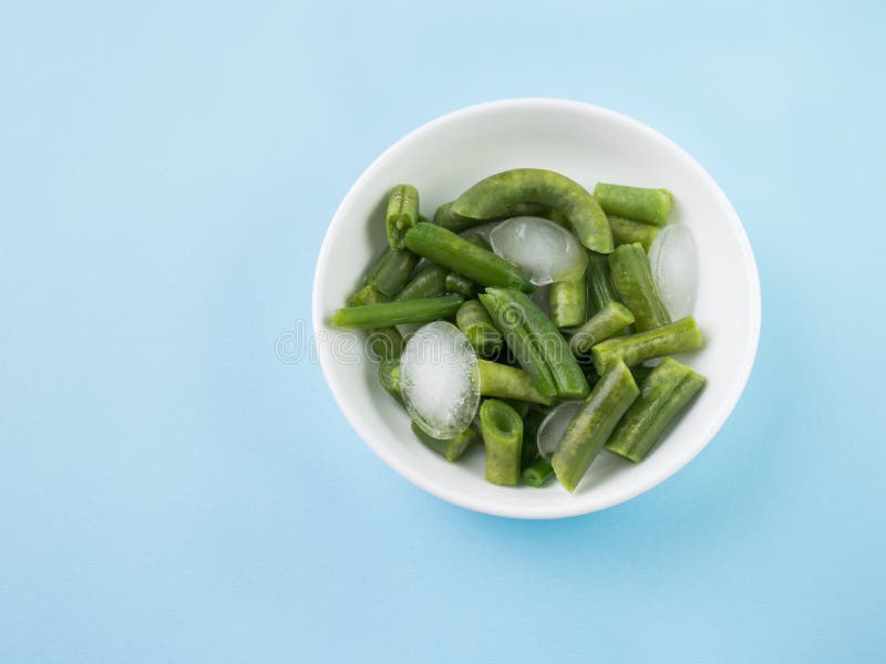 Green Beans Pod with Ice Pieces on a White Plate Stock Image - Image of ...