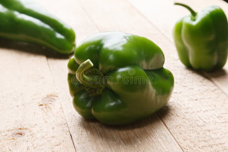 Green Bell Pepper on Wooden Rustick Table. Close Up View Stock Photo ...