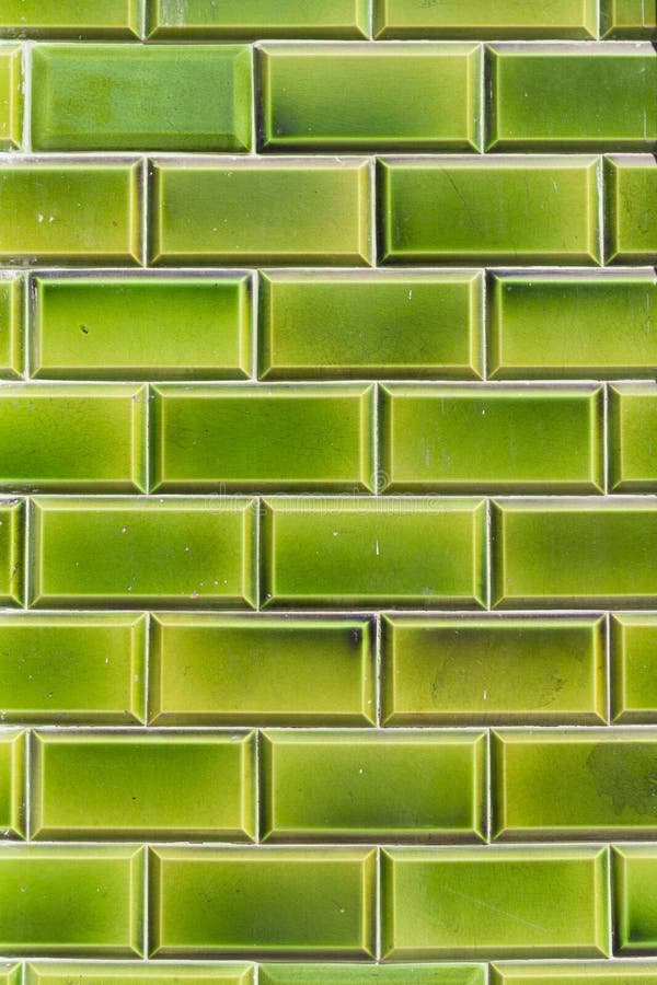 Green Beveled Subway Tile Forming Repeating Pattern on Wall Stock Photo ...