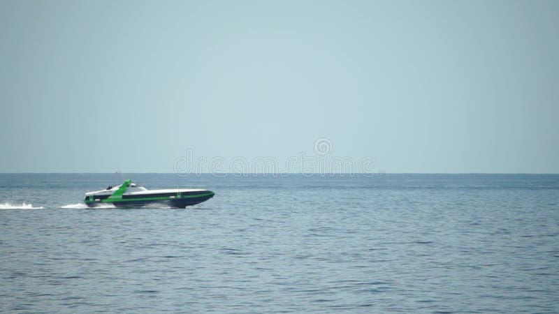 Speedboat on the Horizon stock video. Video of green - 337997001