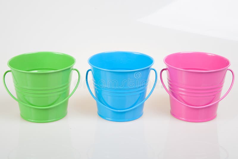 Green, blue and pink pails stock photo. Image of color - 36716590
