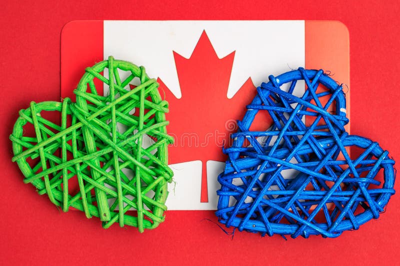 Green and Blue Woven Hearts on Canadian Flag Background Stock Image ...