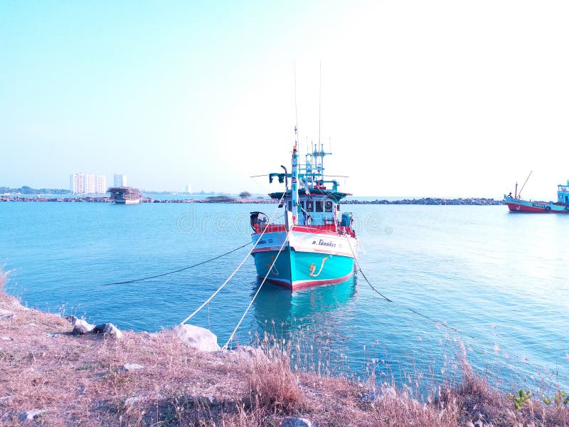 Green Tug Boat Docking at a Quay in Ice at the Montreal Old Port ...