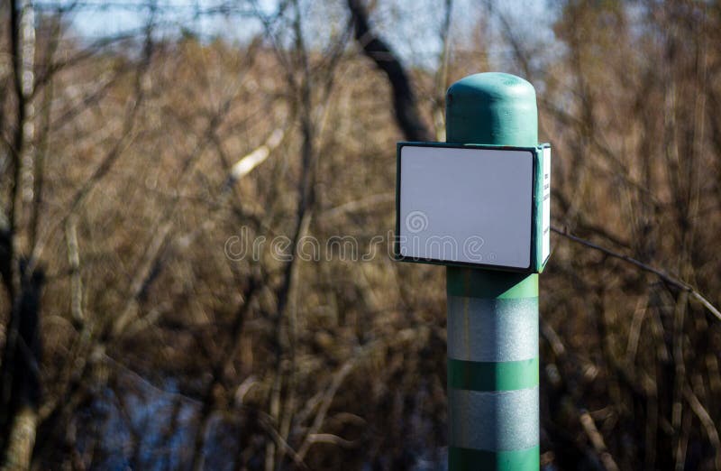 Green Border Post with the Sign Stock Image - Image of spring, grass ...