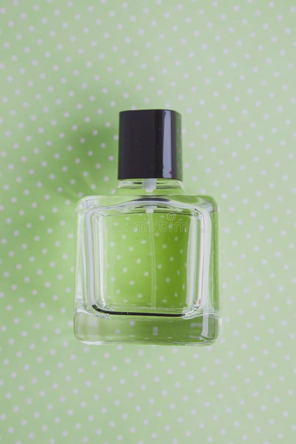 Green Bottle of Perfume on a Green Background Stock Photo - Image of ...