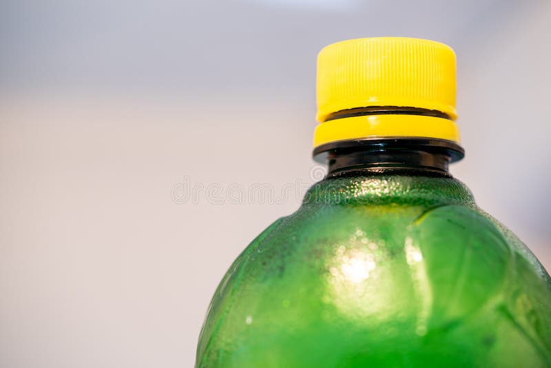 Green Bottle with Yellow Cap Stock Photo - Image of plastic, space ...