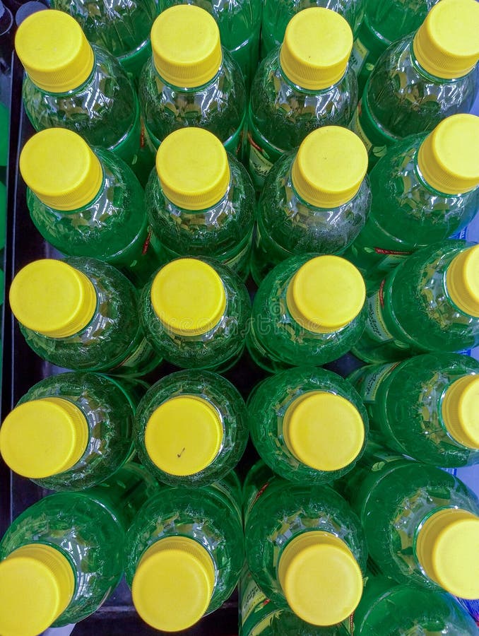 Green Bottles with Yellow Caps Close-Up Editorial Photo - Image of ...