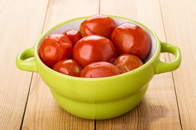Green Bowl with Red Marinated Tomatoes on Table Stock Photo - Image of ...