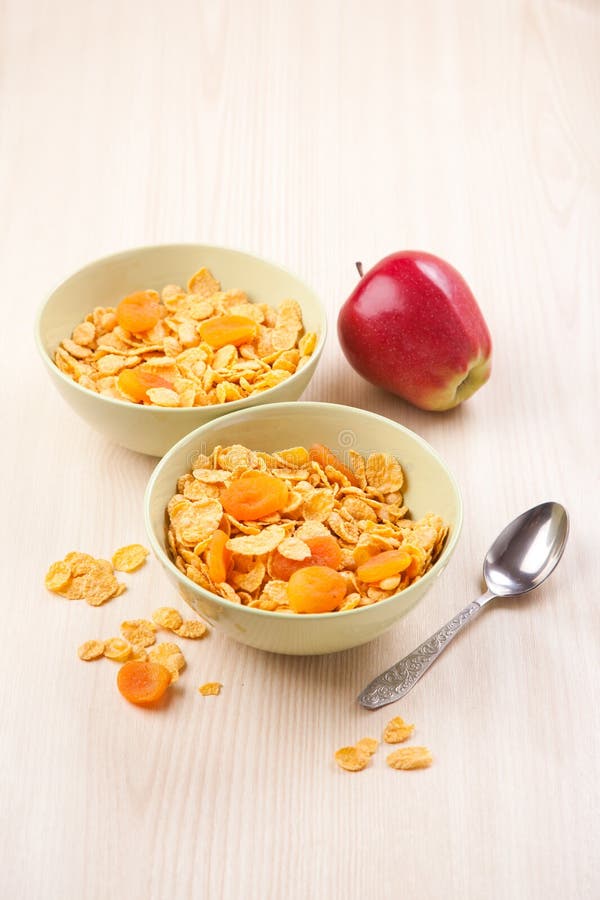 Green Bowls of Crunchy Corn Flakes for Breakfast with Apple on W Stock ...