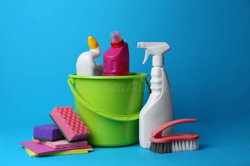 Green Bucket, Cleaning Supplies and Tools on Light Blue Background ...