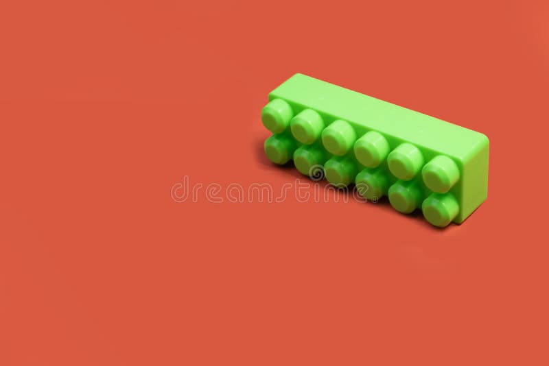 Green Building Block on Orange Background Stock Image - Image of cube ...