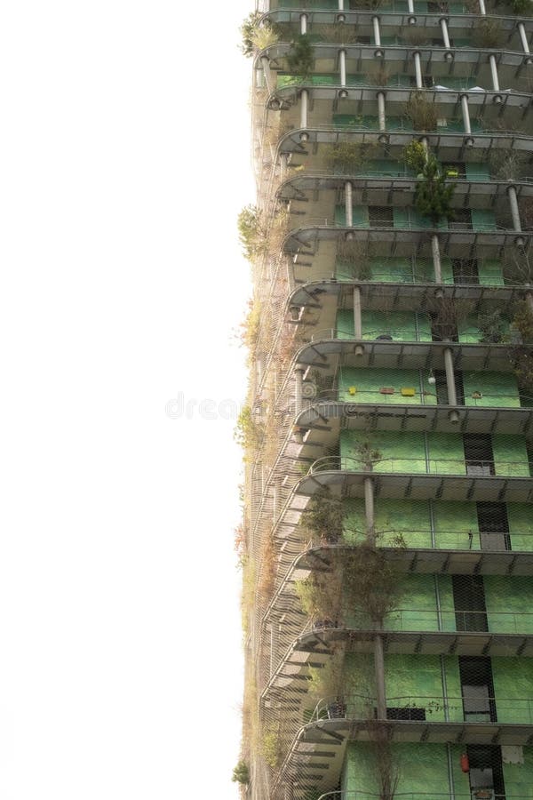 Green Building Wrapped in Mesh, Creating an Interesting and Unusual ...