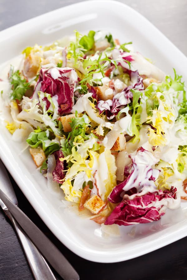Green Caesar Salad with Strawberry in Big White Dish on Sackcloth Wood ...