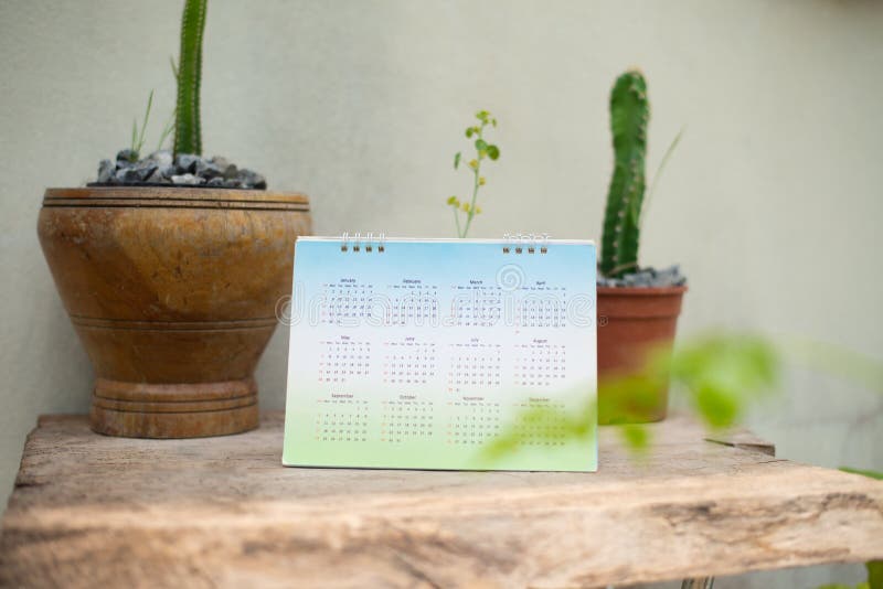 Green Calendar on Wood Table Stock Image - Image of calendar, agenda ...