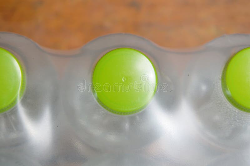 Green Cap Water Bottle in Plastic Pack Stock Image - Image of deliver ...