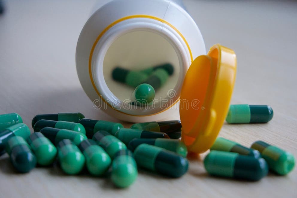 Green capsules container stock photo. Image of hospital - 241737712