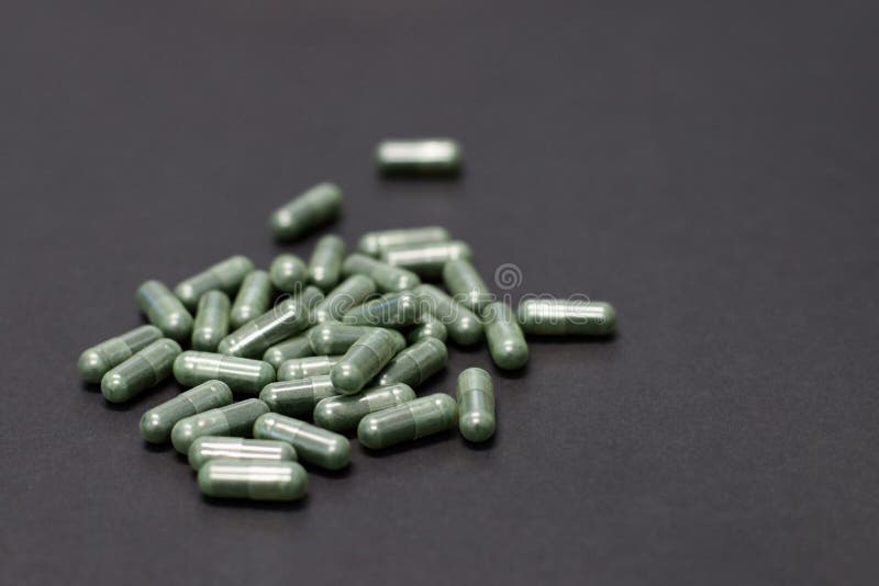 The green capsules stock photo. Image of health, green - 141036292