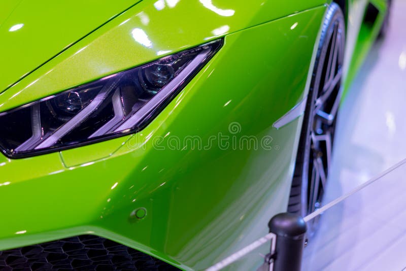 Green Car in the Exhibition Room at the Light Sensitivity. Stock Image ...