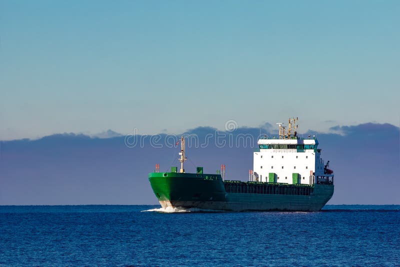 Green cargo ship stock image. Image of delivering, clouds - 88241283