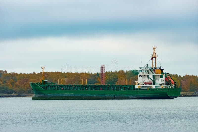 Green cargo ship stock photo. Image of ocean, cloudy - 88472838