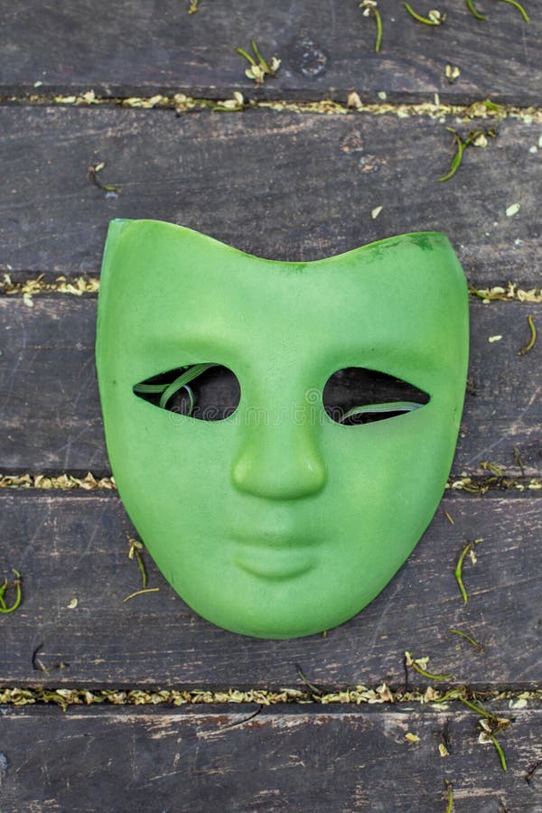 Green Carnival Mask and a Burning Candle on a Background of Shiny ...