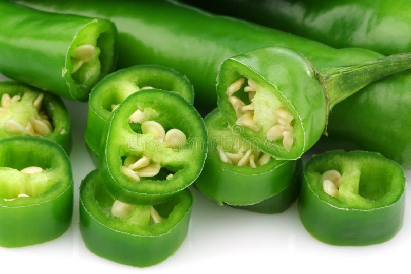 Green Chili Peppers and Cut Pieces Stock Image - Image of close ...