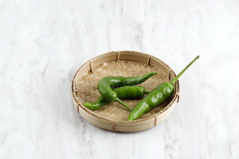 Green Chilli on Bamboo Plate, White Background Stock Image - Image of ...
