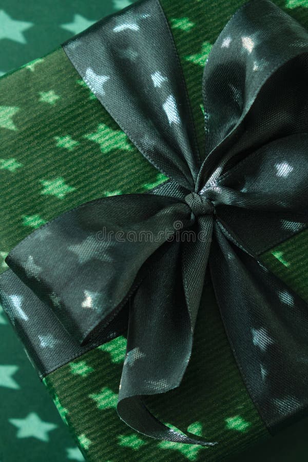 Green Christmas Gift Box with Star Pattern Light Shadows. Stock Photo ...
