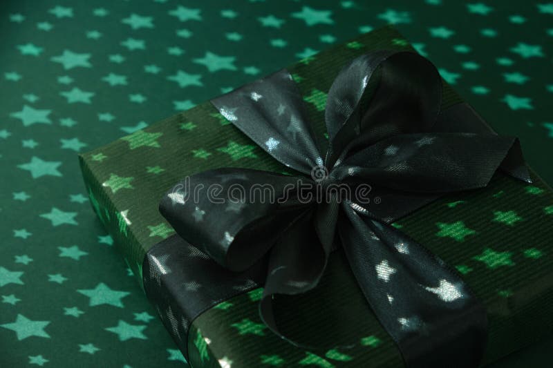 Green Christmas Gift Box with Star Pattern Light Shadows. Stock Photo ...