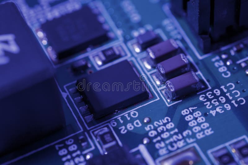 Green Circuit Board with a Black Integrated Circuit Chip and Various ...