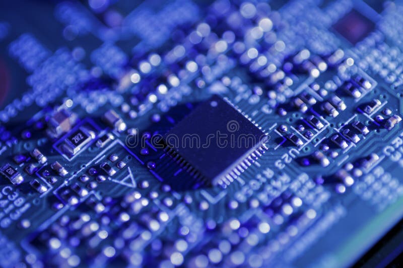 Green Circuit Board with a Black Integrated Circuit Chip and Various ...