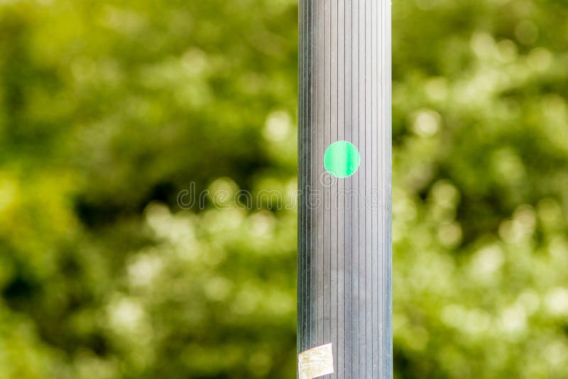 Green Circular Sticker on Pole Stock Photo - Image of green, industrial ...