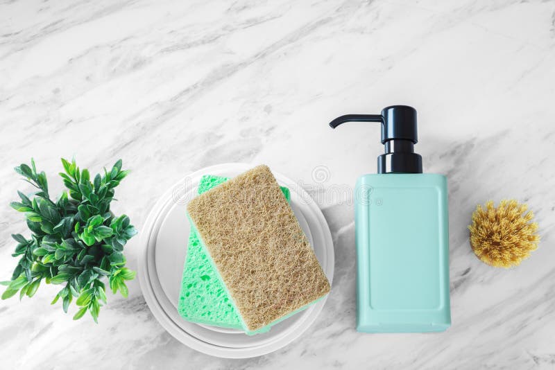 Green Cleaning and Scrub Sponge on Plates with Dish Soap Bottle on ...