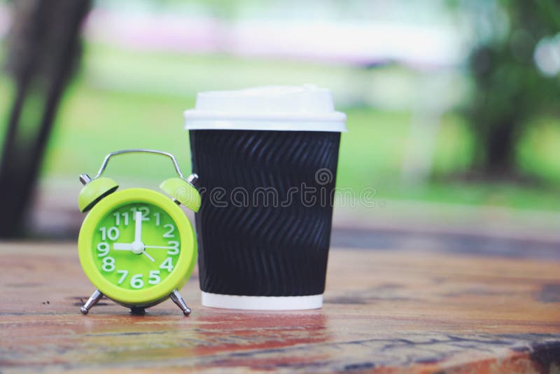 Green clock and cup stock image. Image of aroma, wood - 90909531