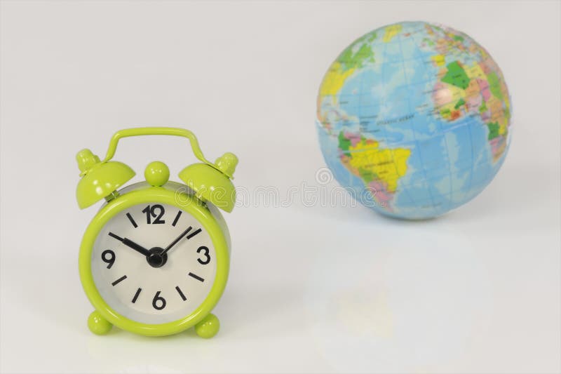 Green Clock and Planet Earth on White Stock Image - Image of studio ...