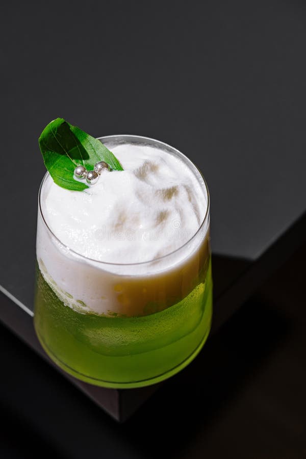 Green Cocktail with Egg White Foam is Standing on Bar Counter Stock ...