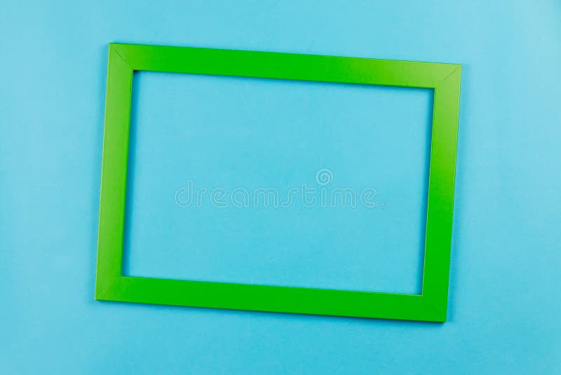 Green Color Frame on Bright Blue Background. Stock Image - Image of ...
