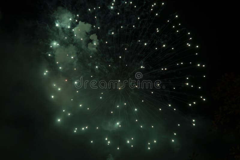 Exploding green firework. stock image. Image of green - 325127029
