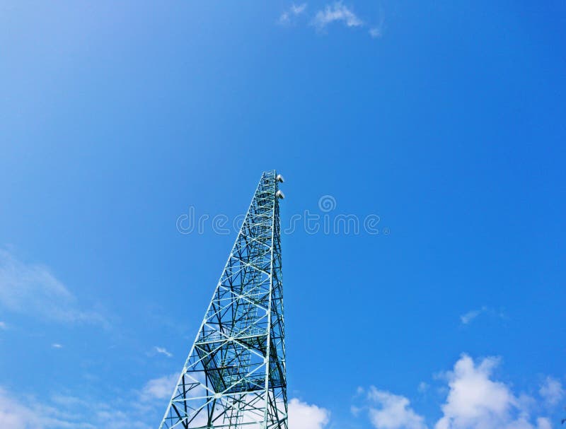 Green Colour of Telecommunication Tower Antenna on Blue Sky Background ...