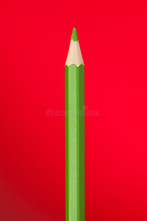Green Colouring Crayon Pencil Isolated on Red Background. Stock Image ...