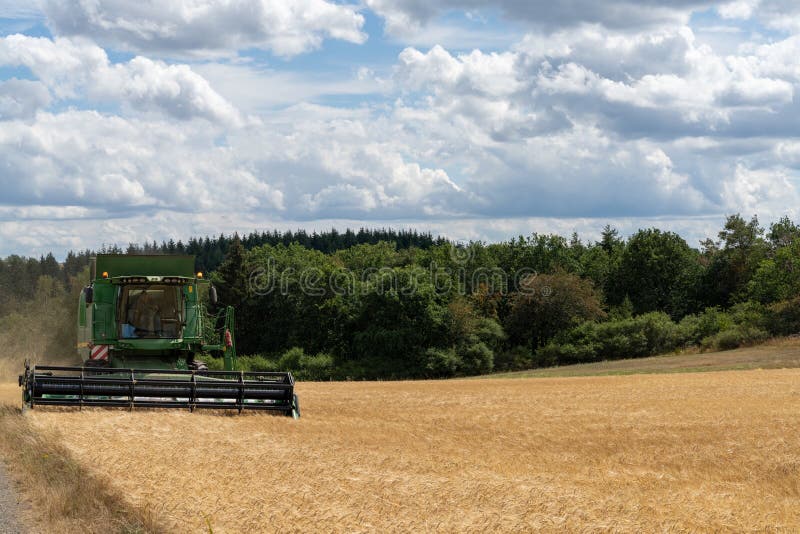 Harvester unloading editorial stock photo. Image of farming - 26421493