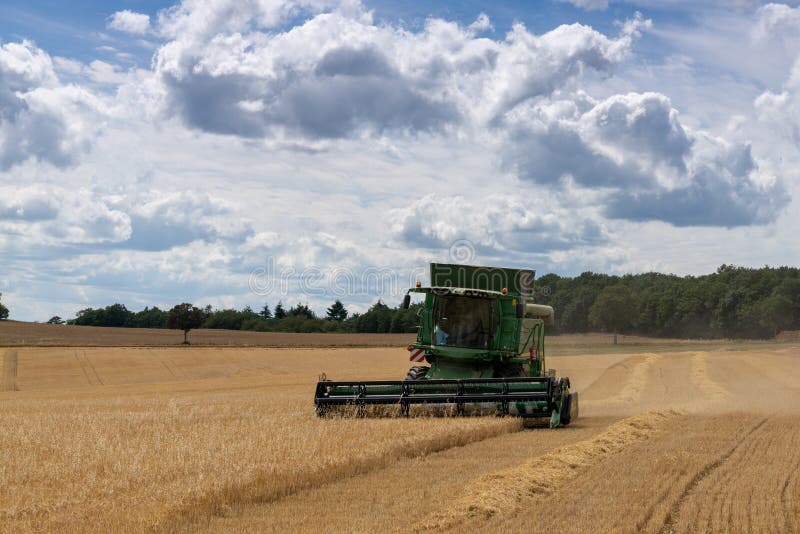 Harvester unloading editorial stock photo. Image of farming - 26421493