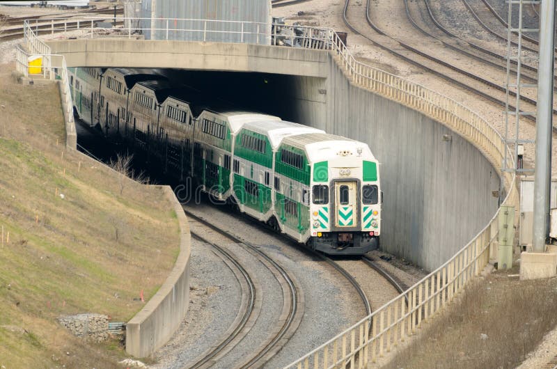 Green commuter train stock image. Image of bridge, carriage - 13716201