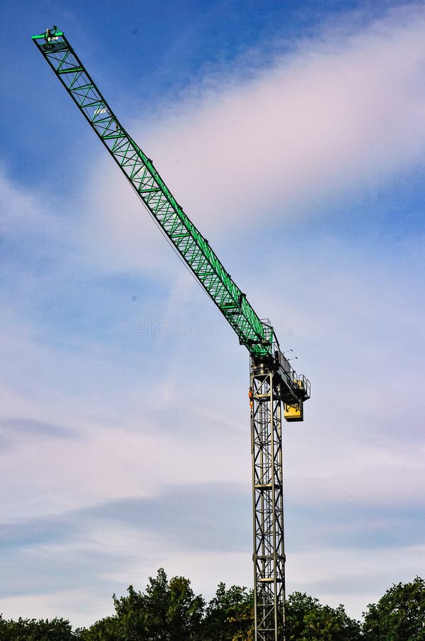 Green construction crane stock photo. Image of front - 265766818